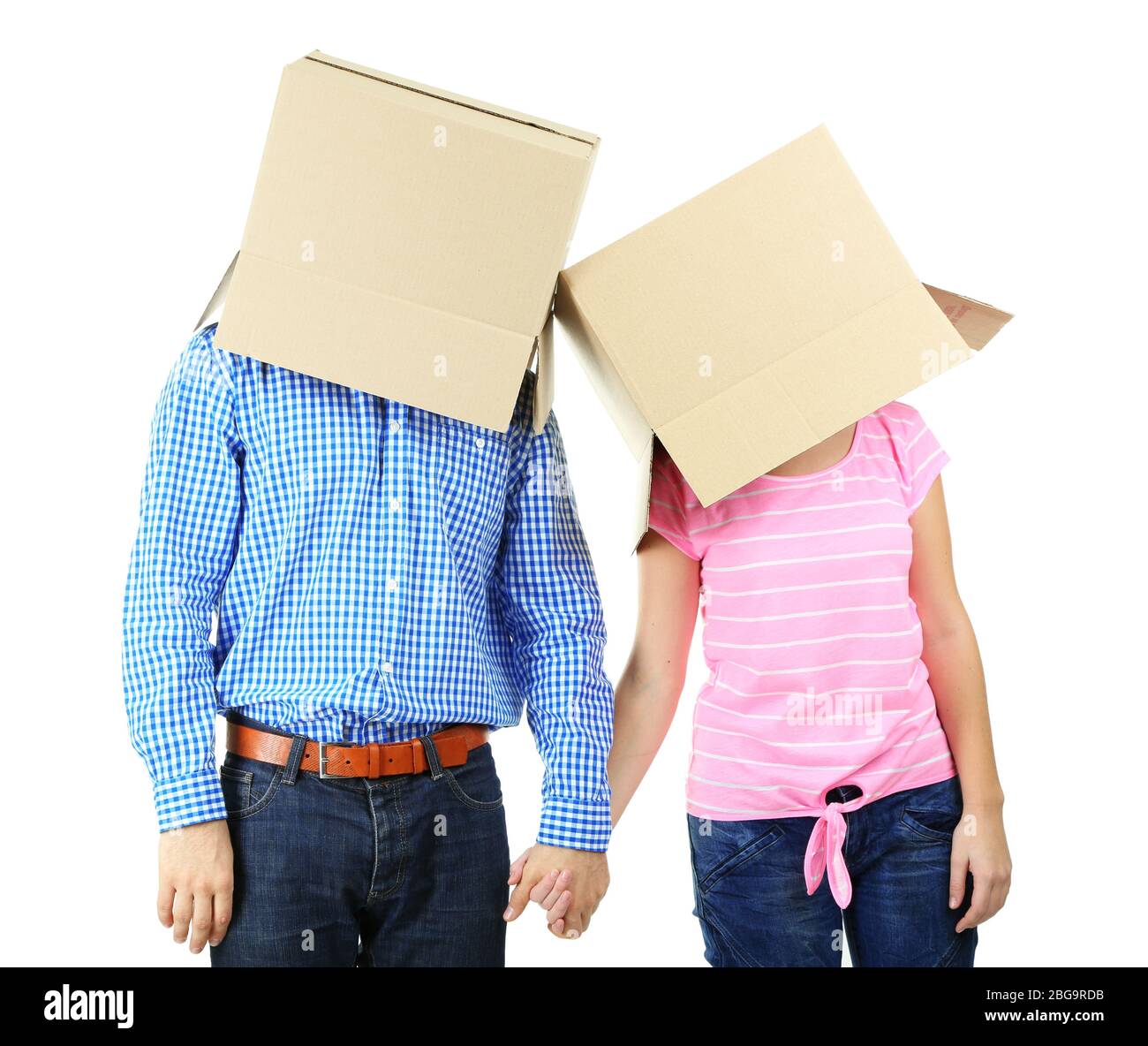 Couple with cardboard boxes on their heads isolated on white Stock ...