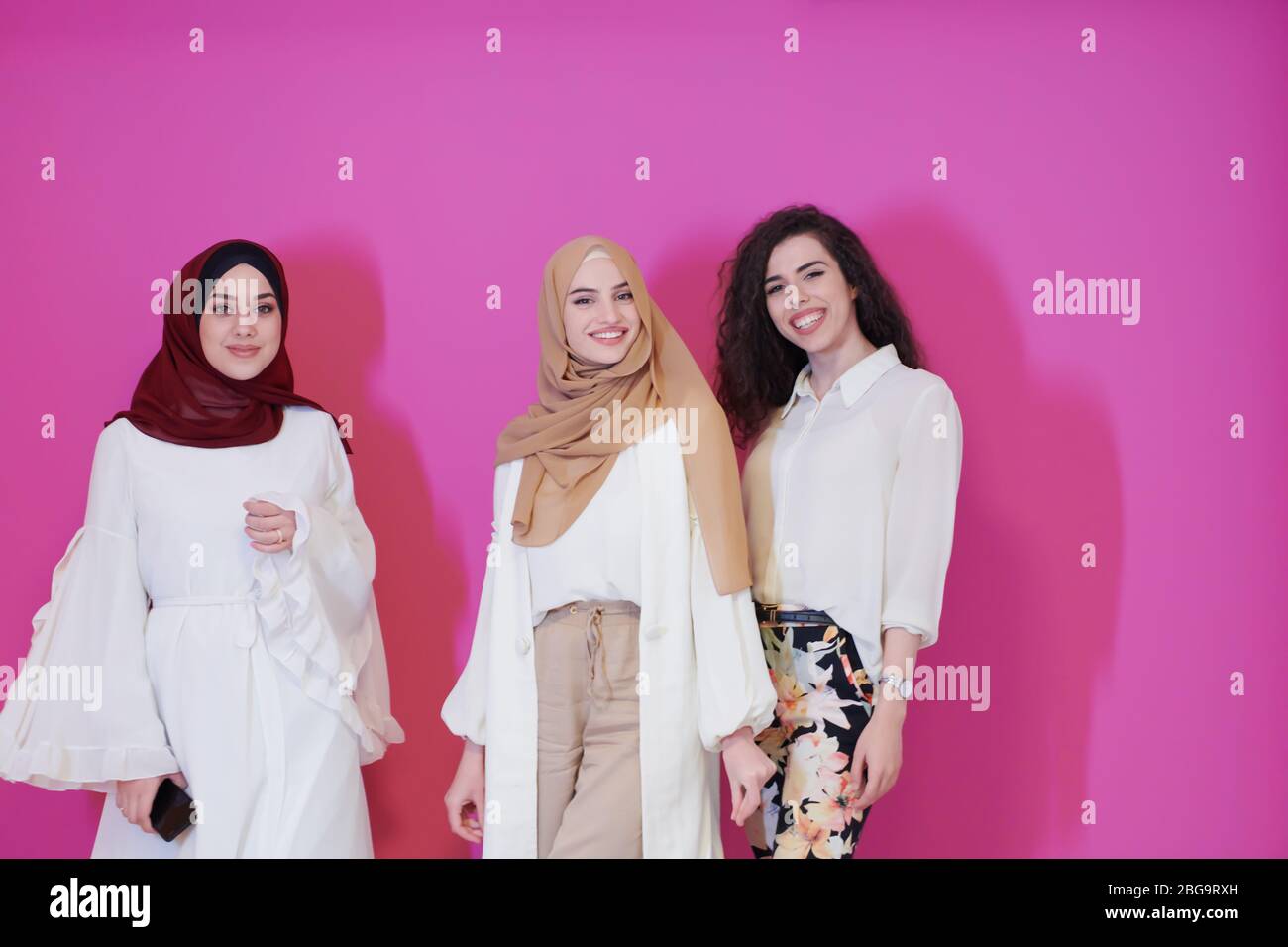 group portrait of beautiful muslim women two of them in fashionable ...