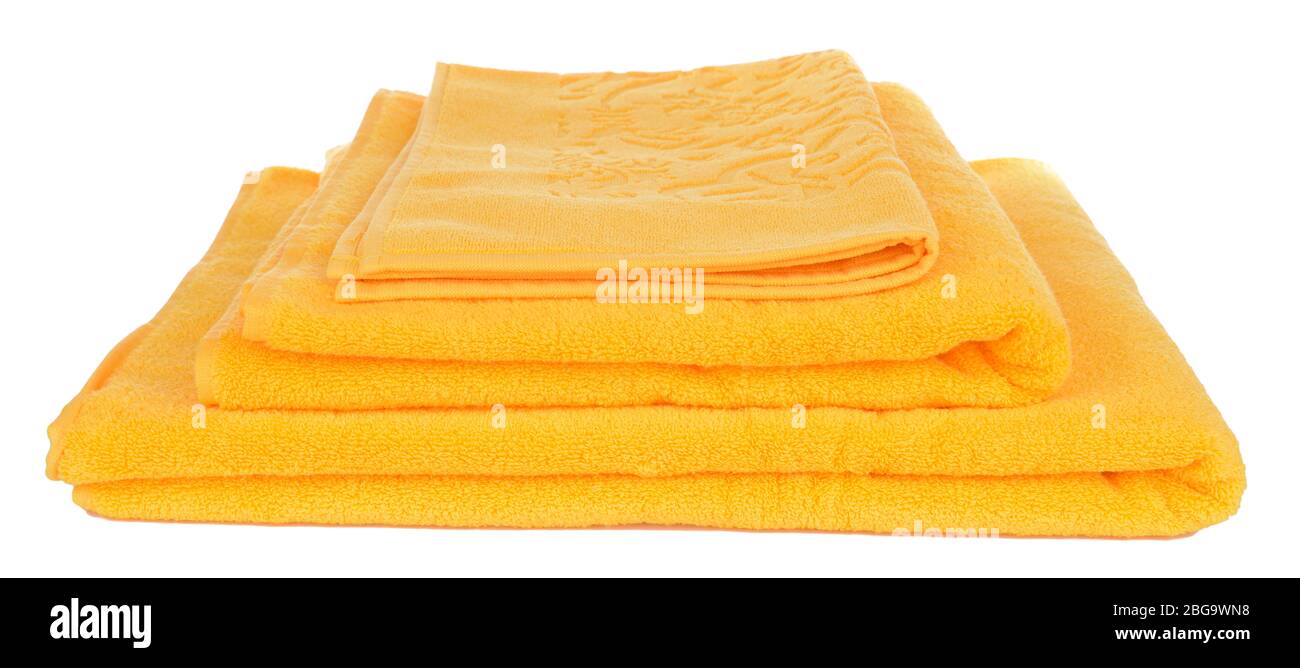 Yellow towels isolated on white Stock Photo - Alamy