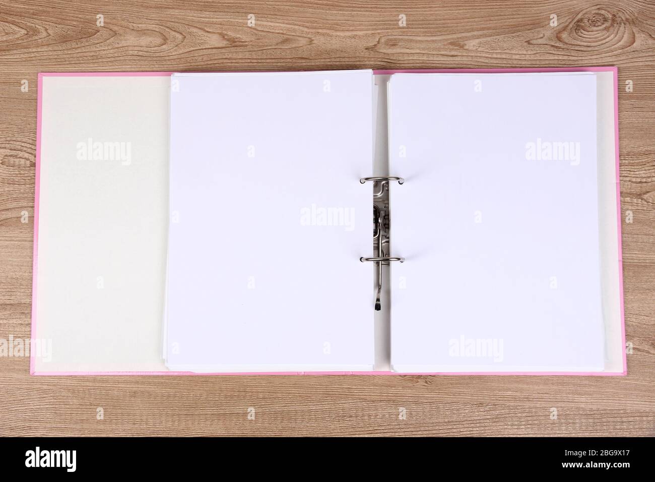 Open file folder on desk Stock Photo - Alamy