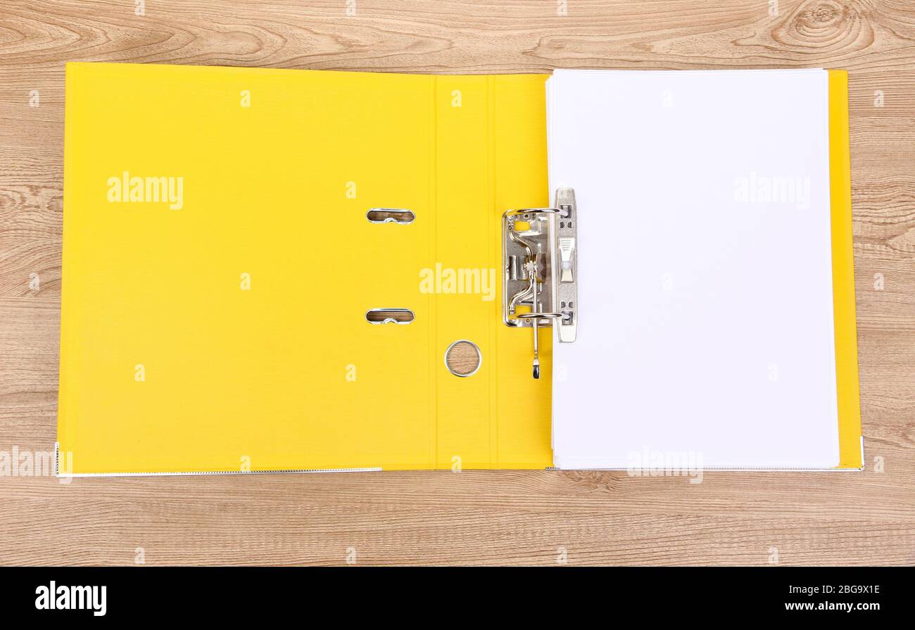 Open file folder on desk Stock Photo - Alamy