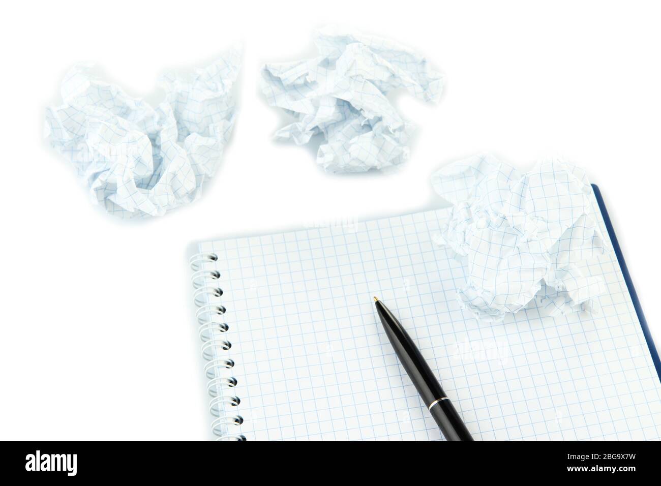 Crumpled paper balls with notebook and pen isolated on white Stock ...