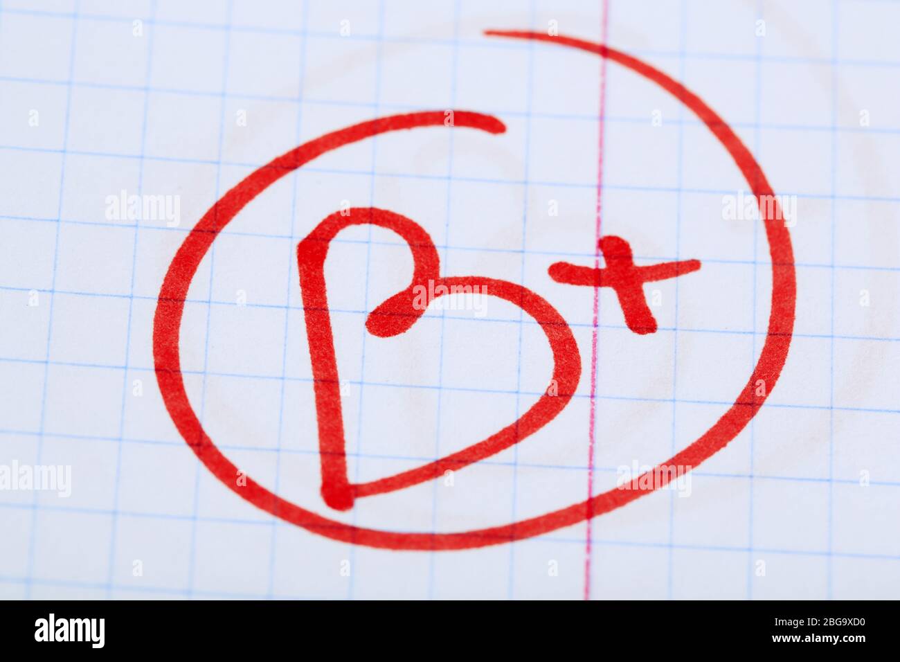 Grade B+ written on an exam paper Stock Photo - Alamy