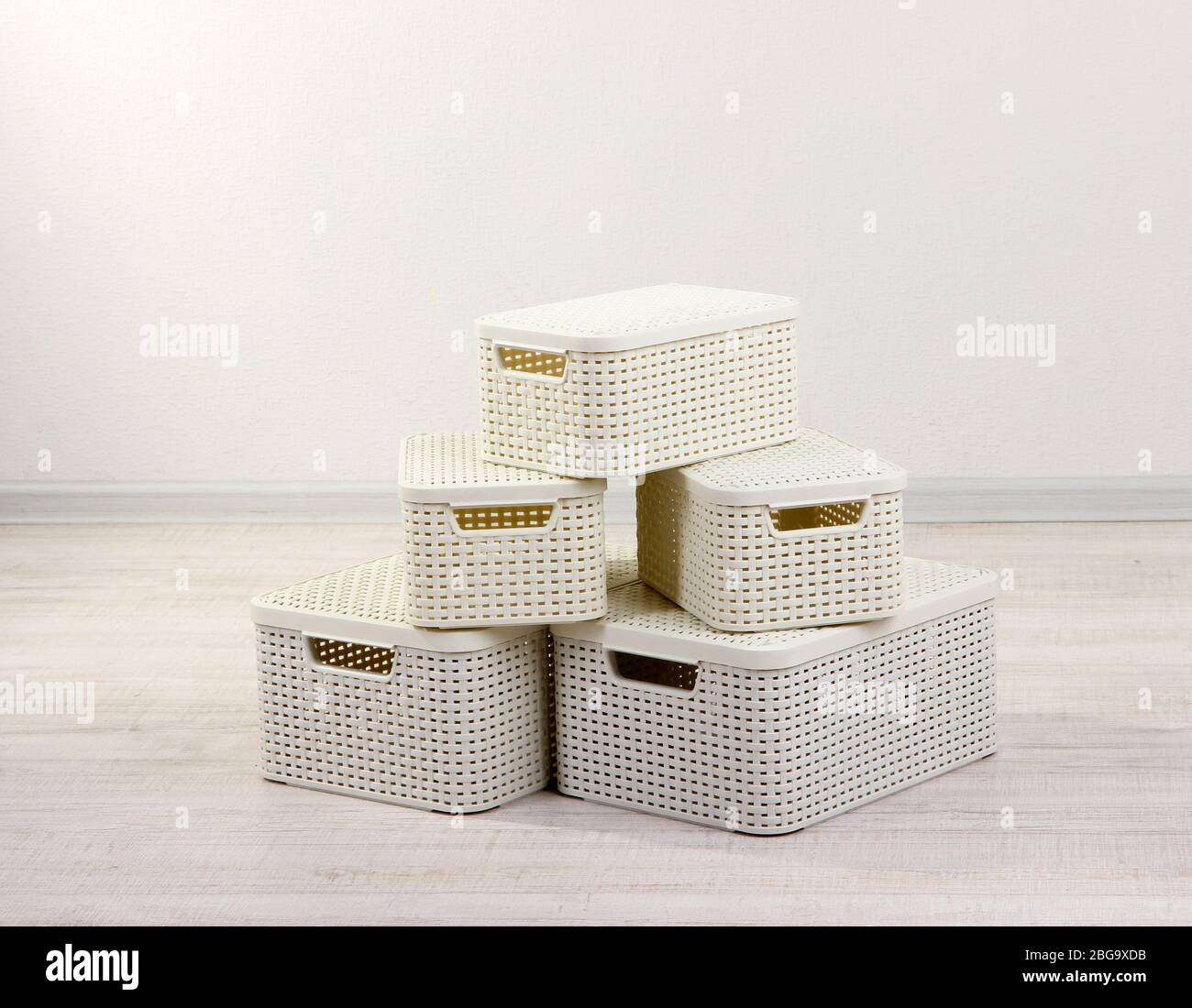 Plastic baskets for storing things in floor on room background Stock ...