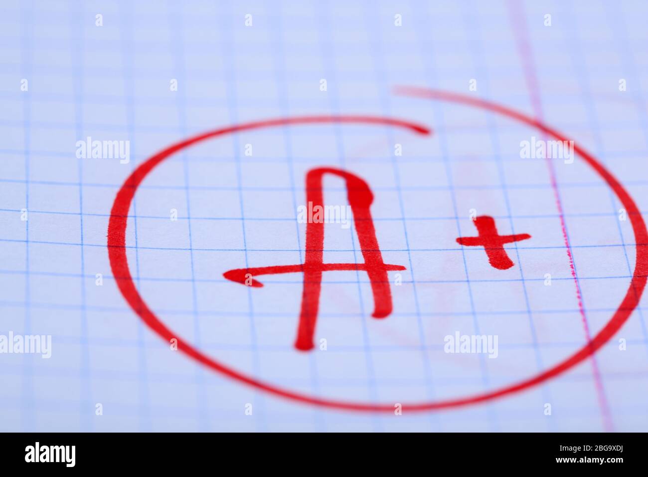 Grade A+ written on an exam paper Stock Photo - Alamy