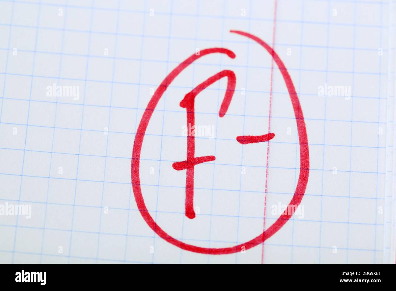 Grade F- written on an exam paper Stock Photo - Alamy