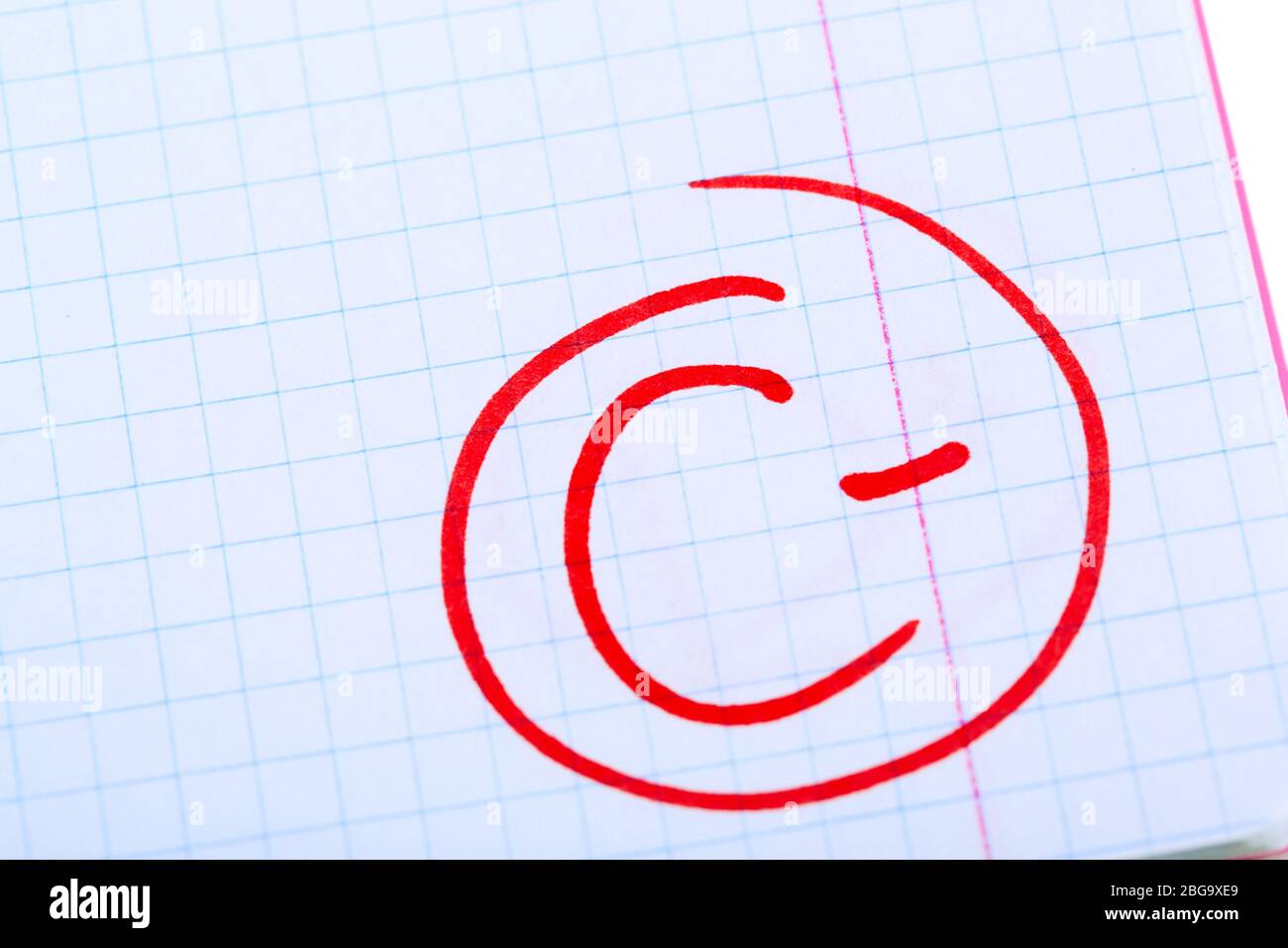 Grade C- written on an exam paper Stock Photo - Alamy