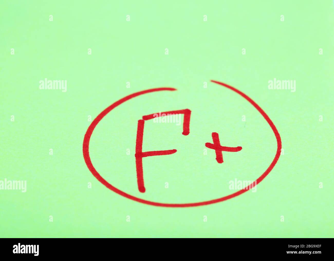 Grade F+ written on an exam paper Stock Photo - Alamy