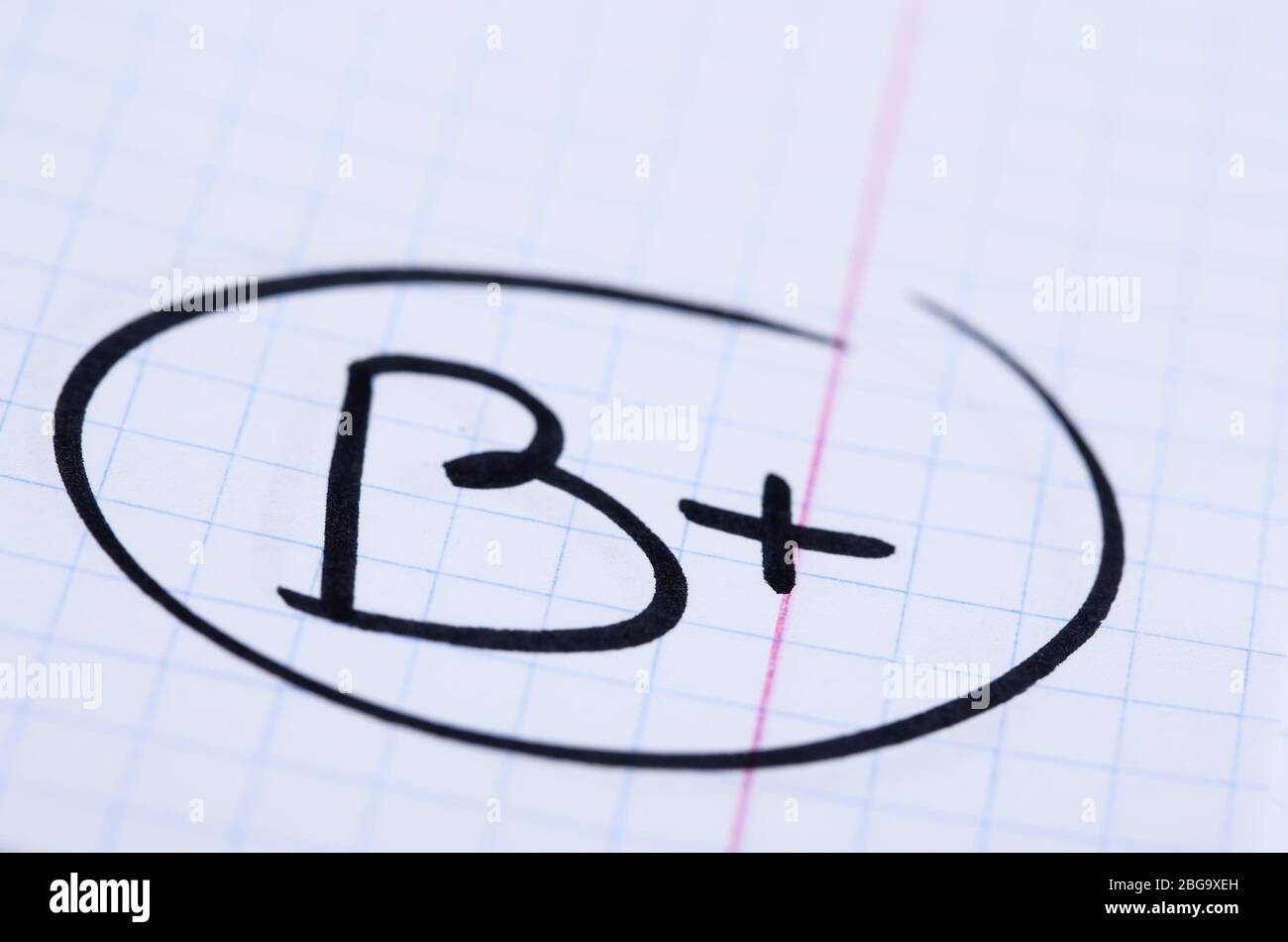 Grade B+ written on an exam paper Stock Photo - Alamy