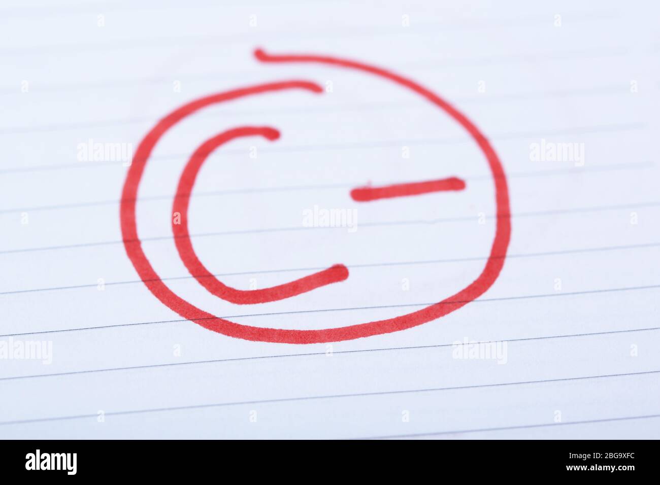 Grade C- written on an exam paper Stock Photo - Alamy