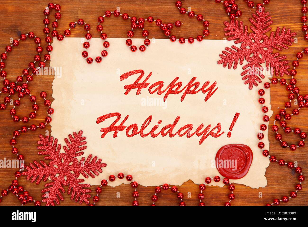 Frame with vintage paper and Christmas decorations on wooden background ...