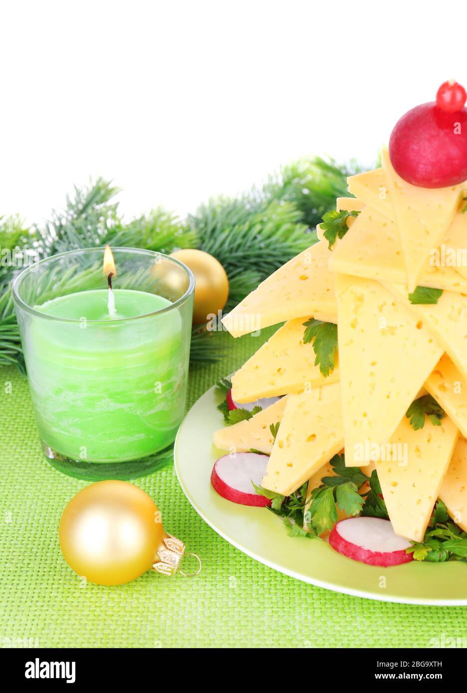Christmas tree from cheese on table on white background Stock Photo - Alamy