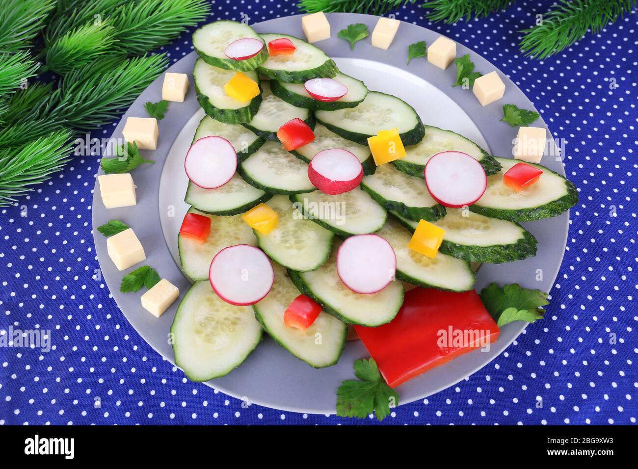 Christmas tree from cucumber on plate on table close-up Stock Photo - Alamy