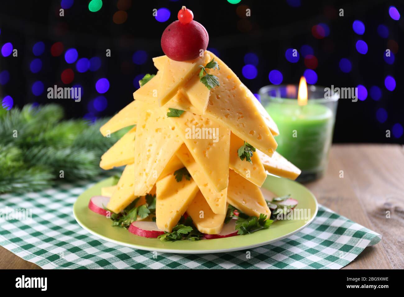 Christmas tree from cheese on table on dark background Stock Photo - Alamy