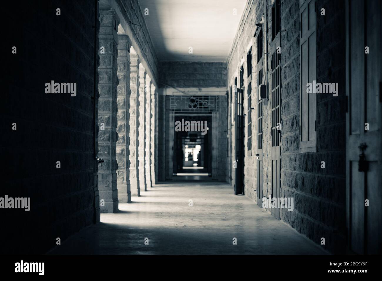 A beautiful monochrome picture of a long corridor in an old vintage ...