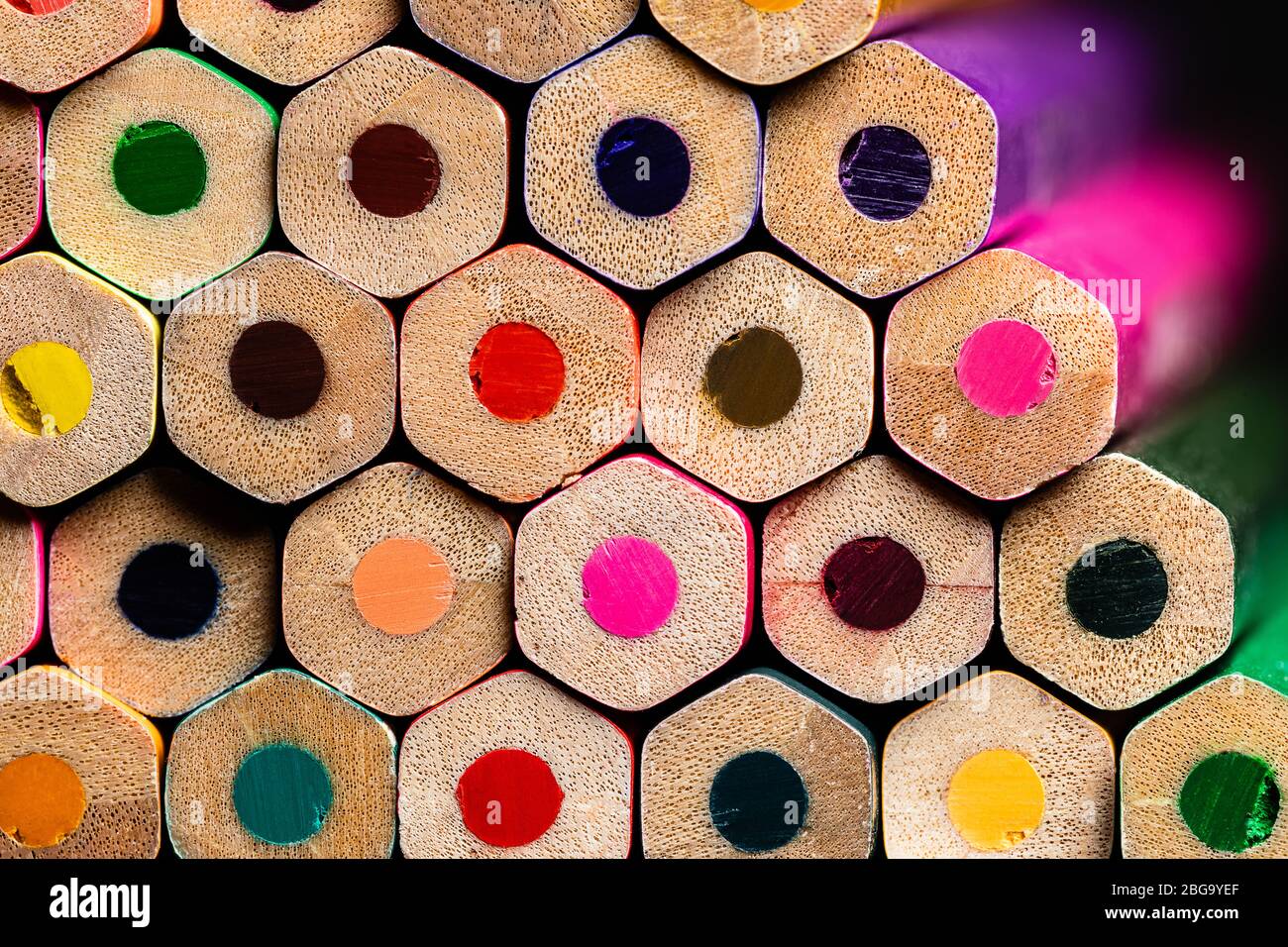 A macro of a very OCD orderly stack of unsharpened colored pencil ends from a mildly oblique ...