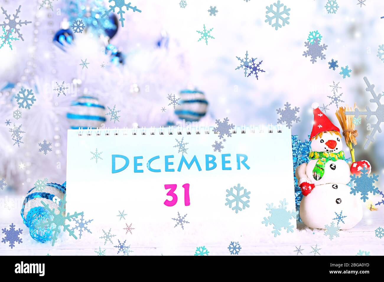 Calendar with New Year decorations on winter background Stock Photo - Alamy