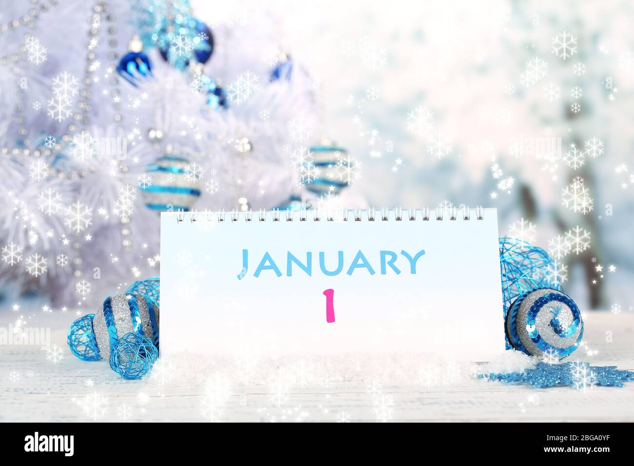 Calendar with New Year decorations on winter background Stock Photo - Alamy