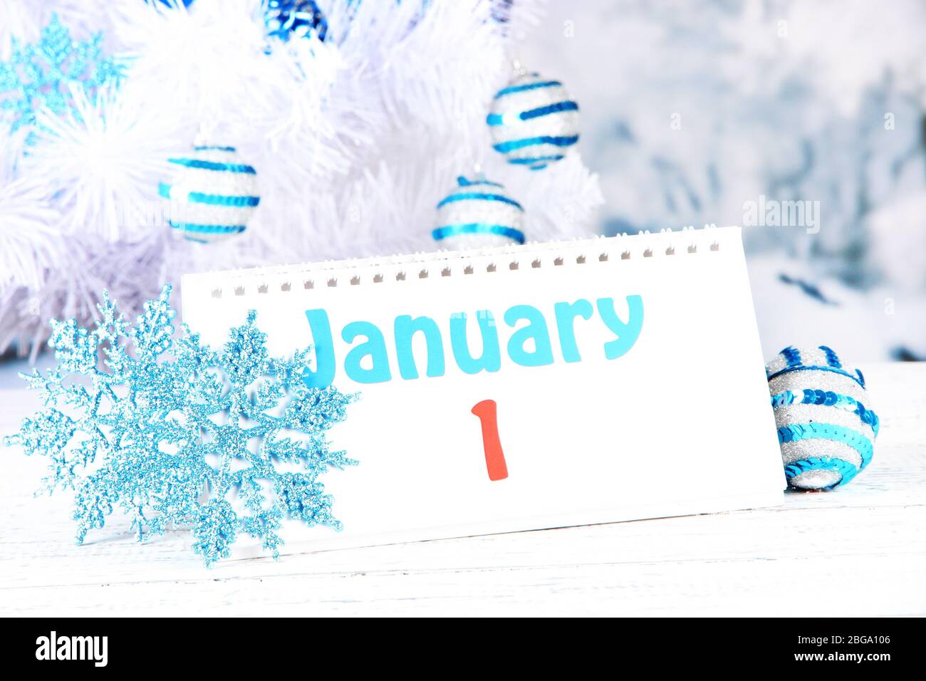Calendar with New Year decorations on winter background Stock Photo - Alamy