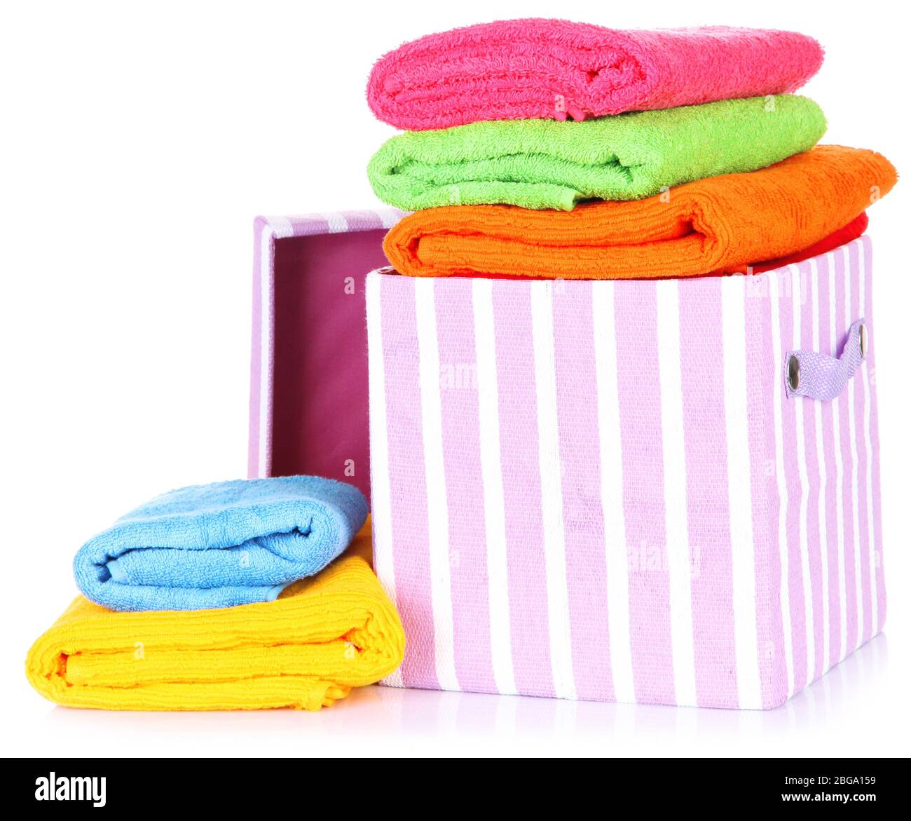 Textile box with bright towels, isolated on white Stock Photo - Alamy