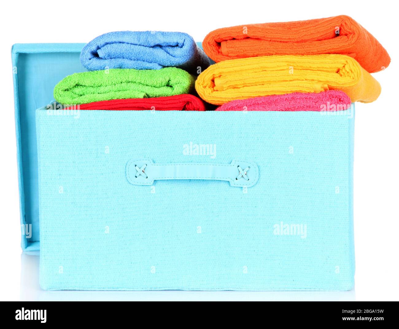 Textile box with bright towels, isolated on white Stock Photo - Alamy