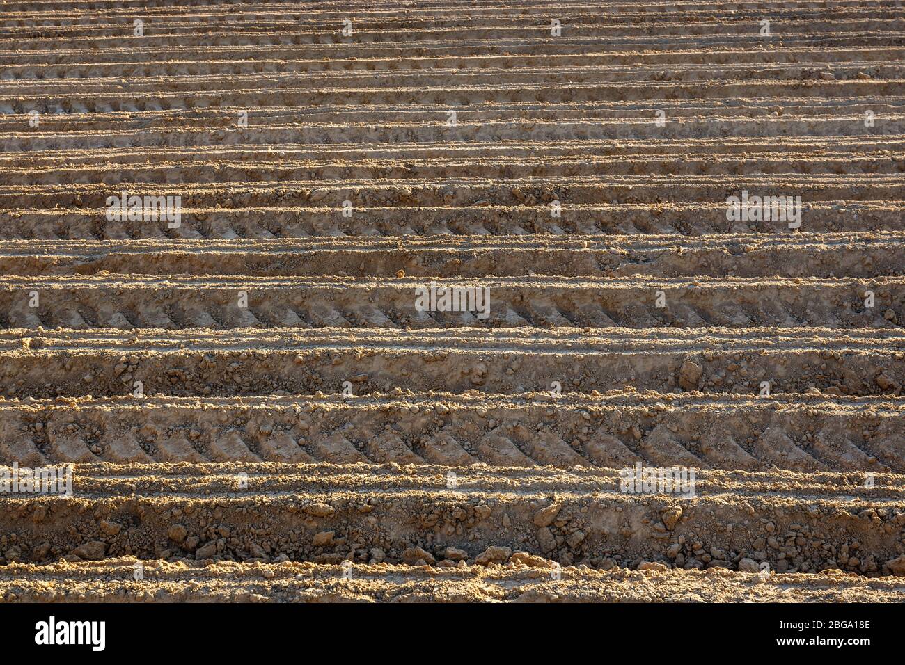 Furrows row pattern in a plowed field prepared for planting crops in ...