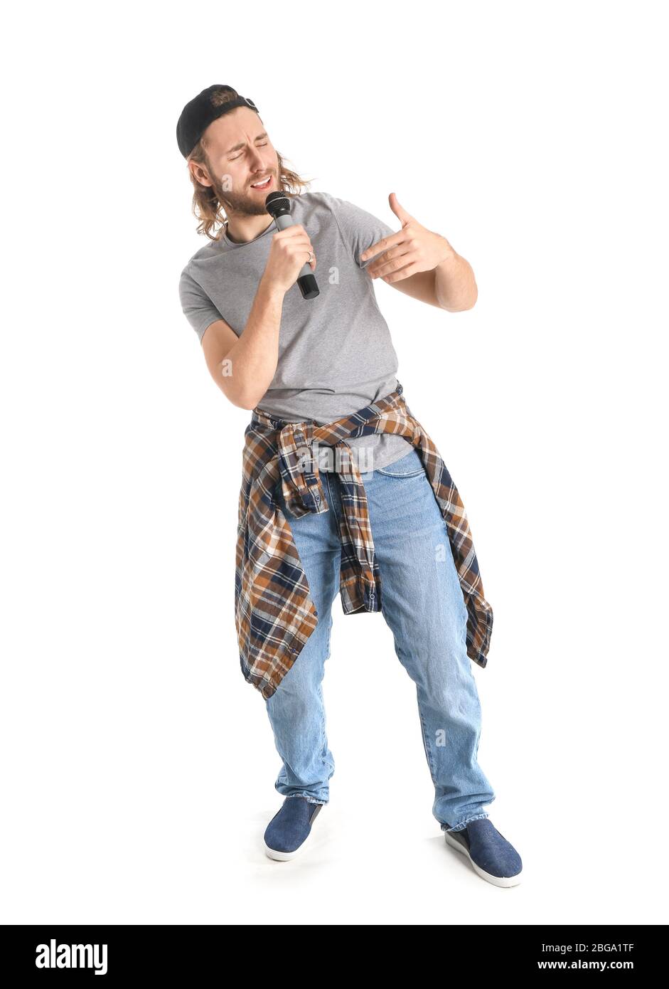 Young male singer on white background Stock Photo - Alamy