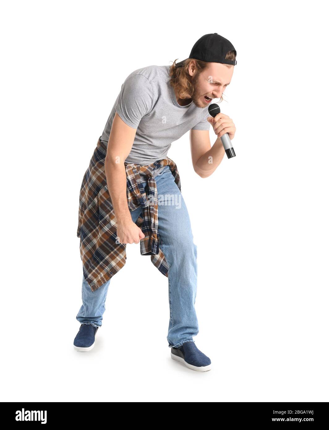 Young male singer on white background Stock Photo - Alamy