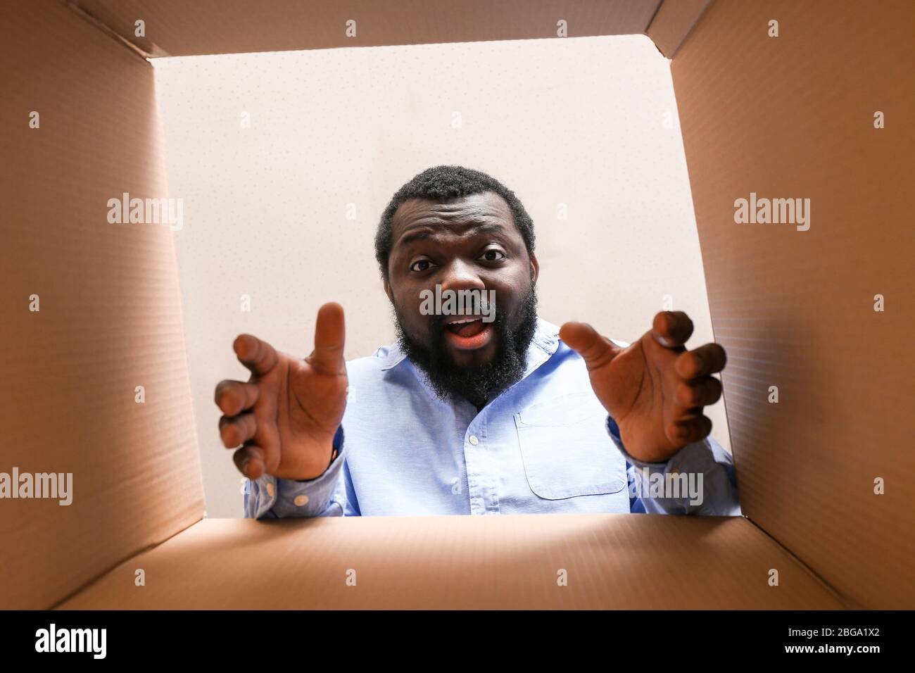 African man unpacking store hi-res stock photography and images - Alamy