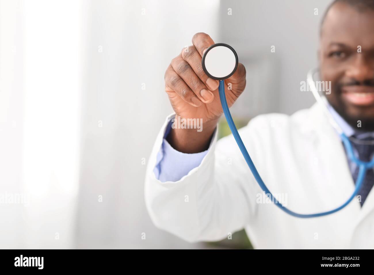 Male African-American doctor with stethoscope in clinic, closeup Stock ...