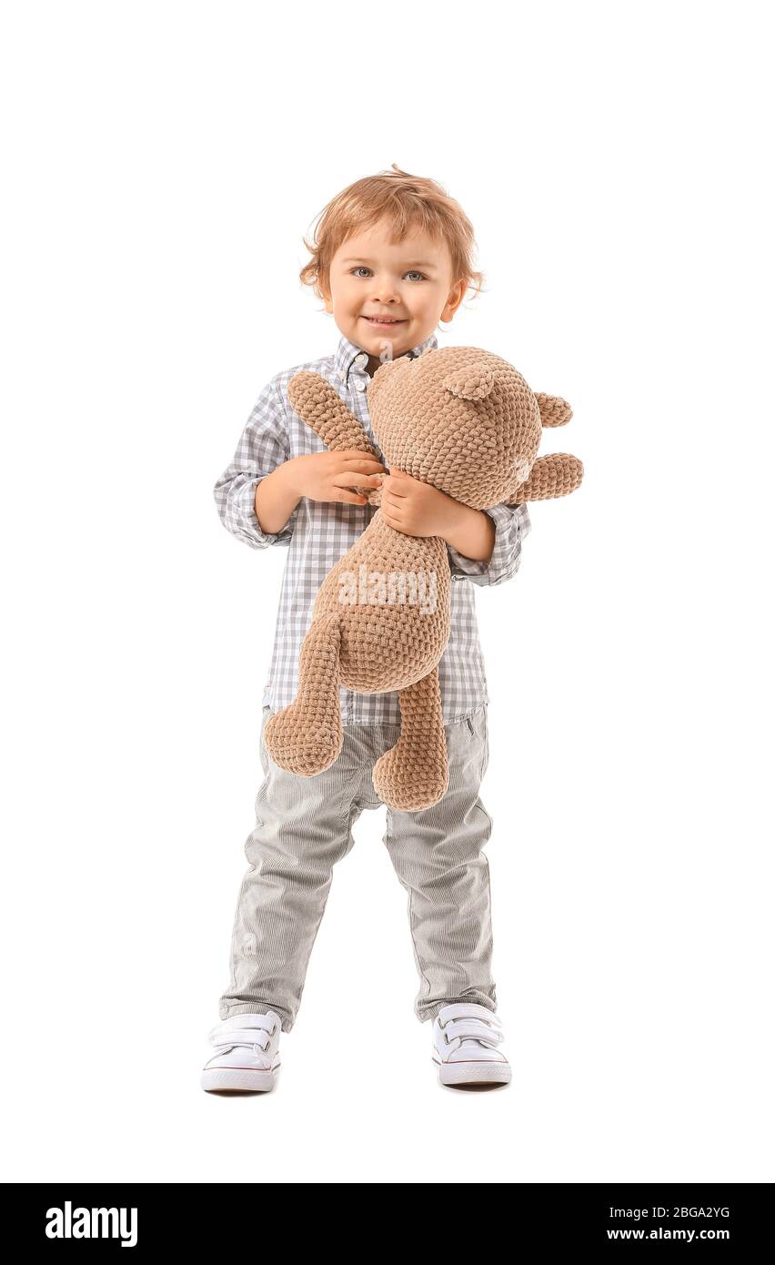 Cute little boy with teddy bear on white background Stock Photo - Alamy