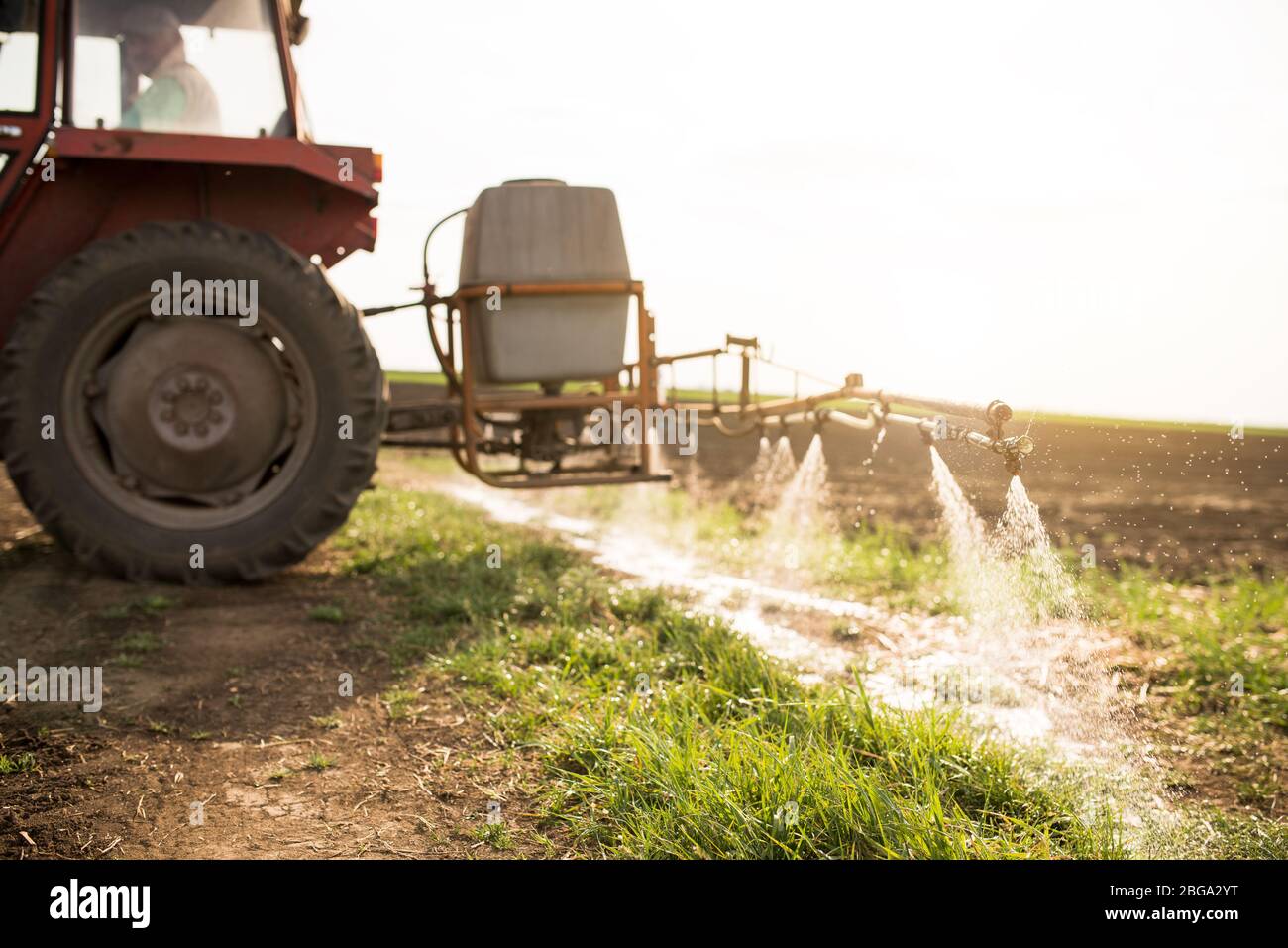 Agricultural sprayers, spray chemicals on field. spraying pesticides on ...