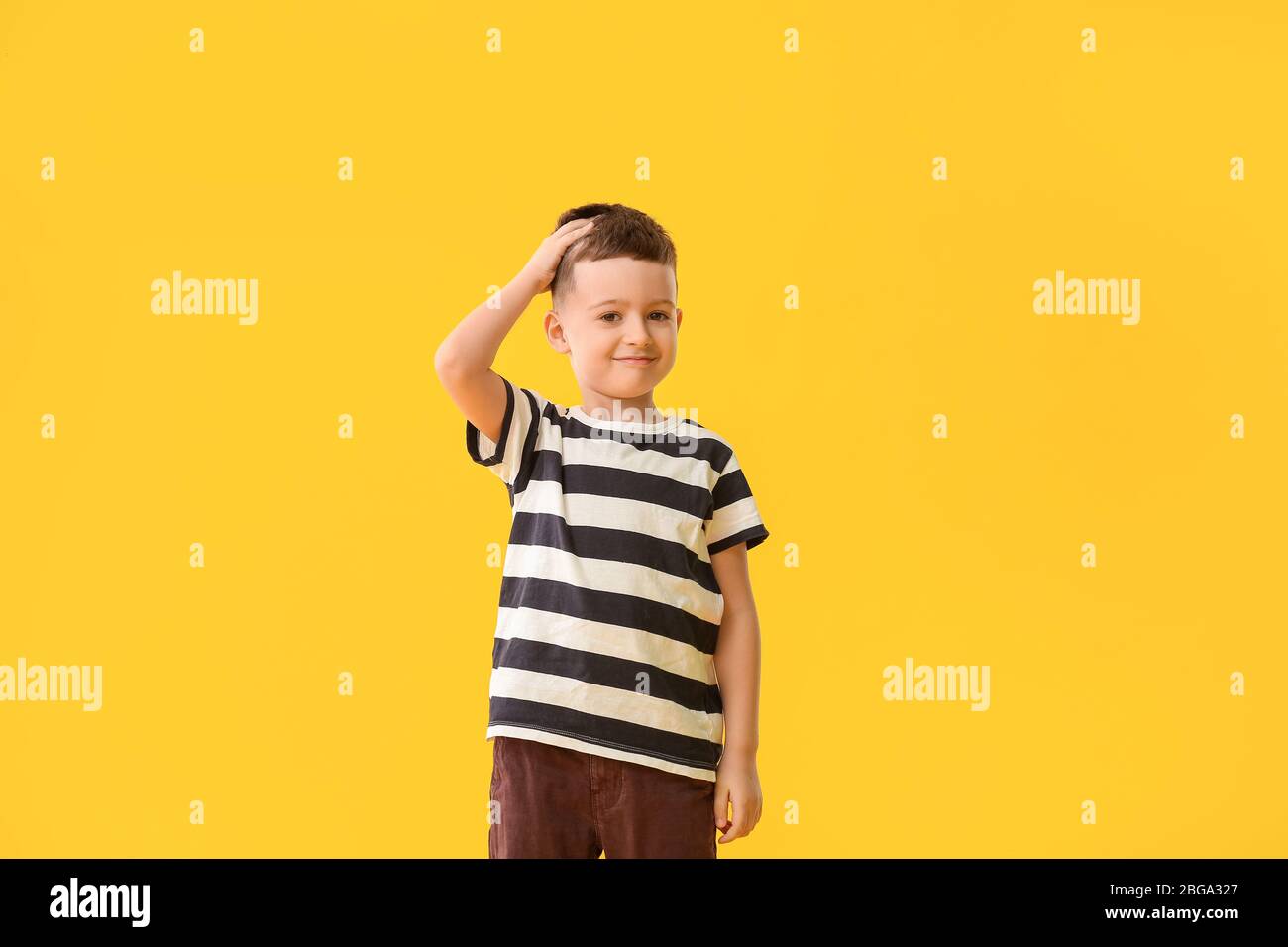 Cute little boy on color background Stock Photo - Alamy
