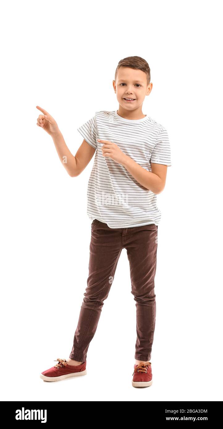 Cute little boy pointing at something on white background Stock Photo ...