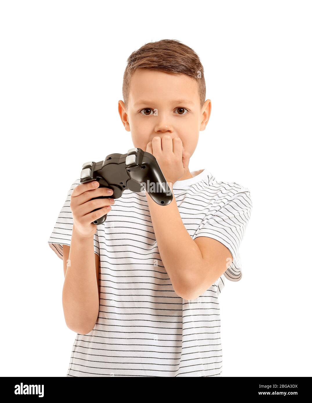 Cute little boy playing video game on white background Stock Photo - Alamy