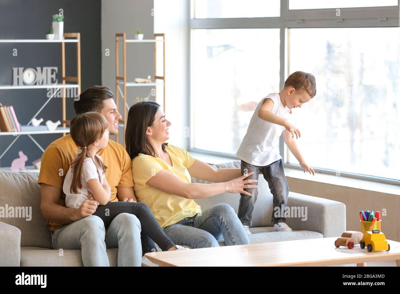 Happy family having fun at home Stock Photo - Alamy