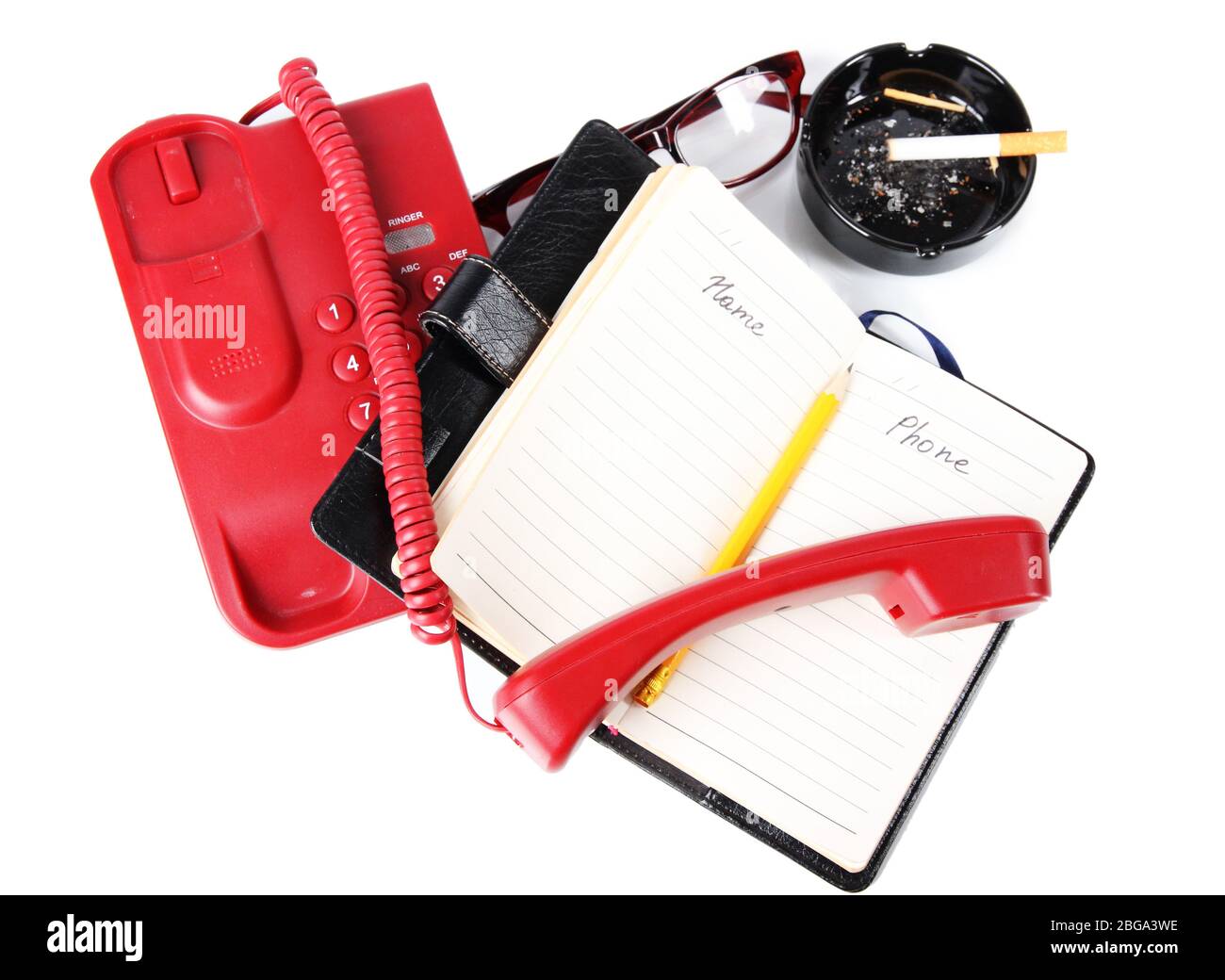 Telephone and notepad and other items, isolated on white Stock Photo ...