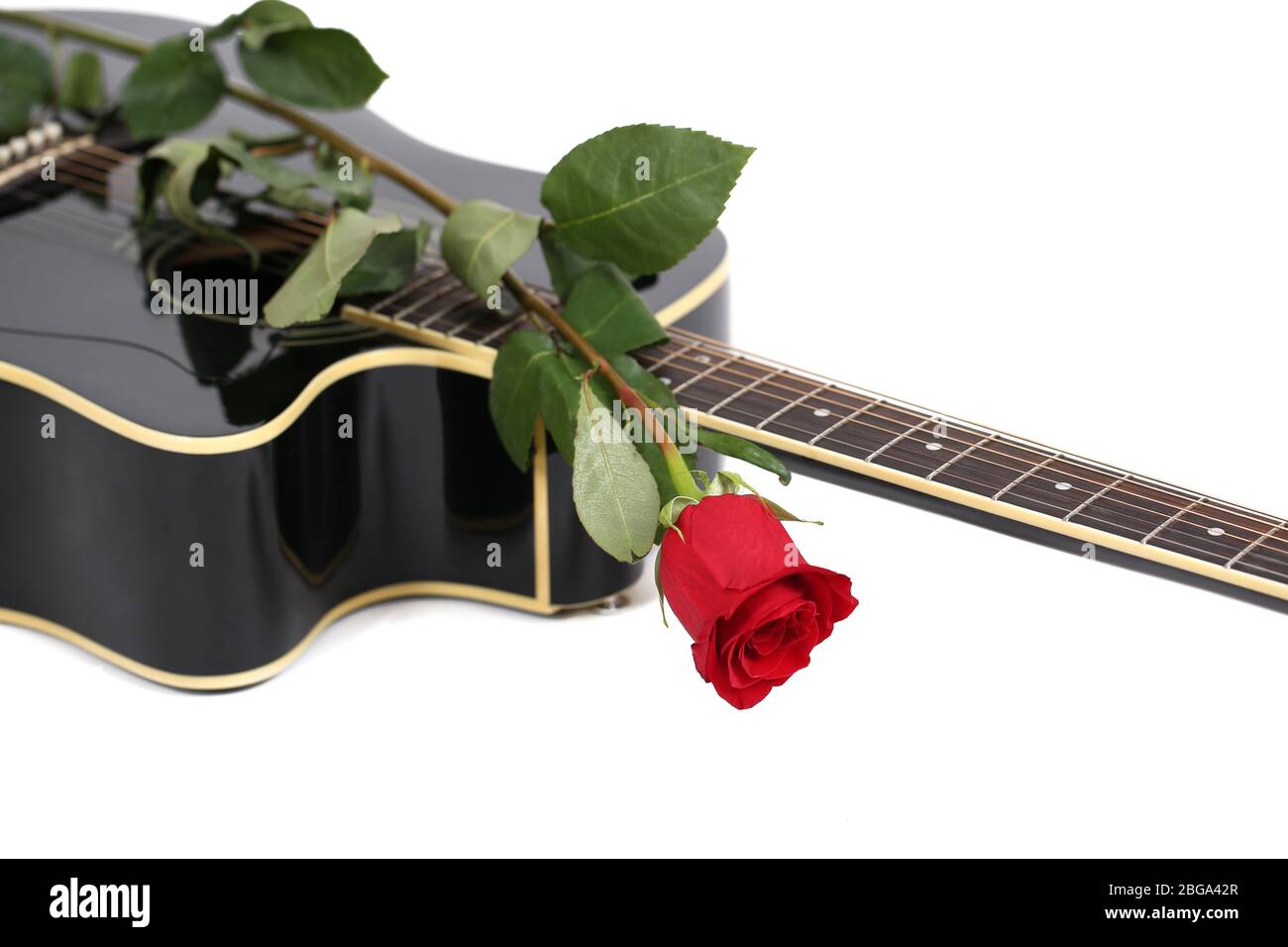 Acoustic guitar and red rose flower, isolated on white Stock Photo - Alamy