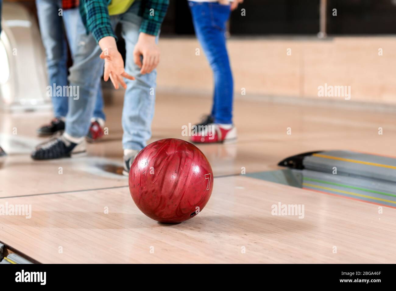Little children playing bowling in club Stock Photo - Alamy
