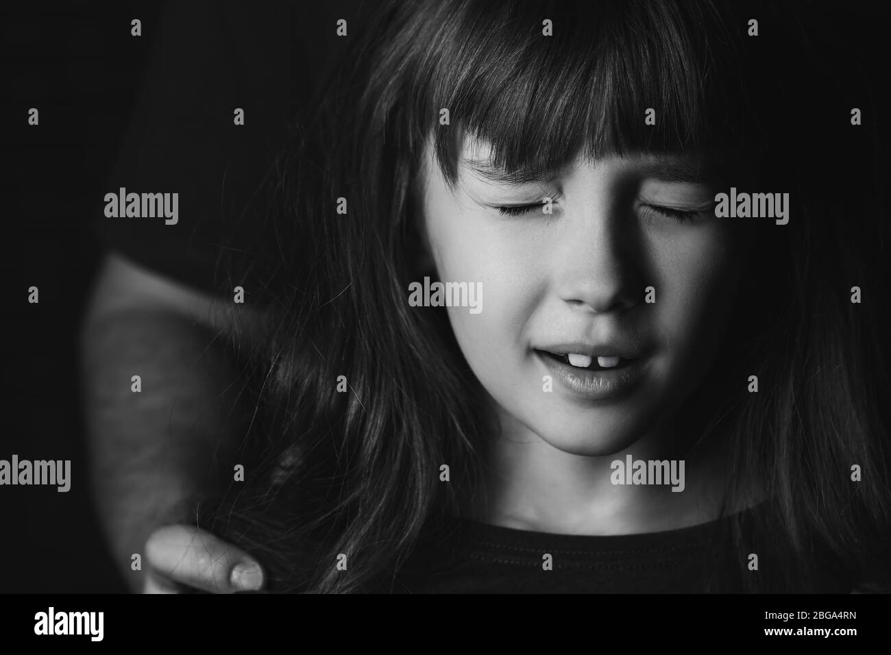 Father with his scared little daughter, closeup. Concept of domestic ...