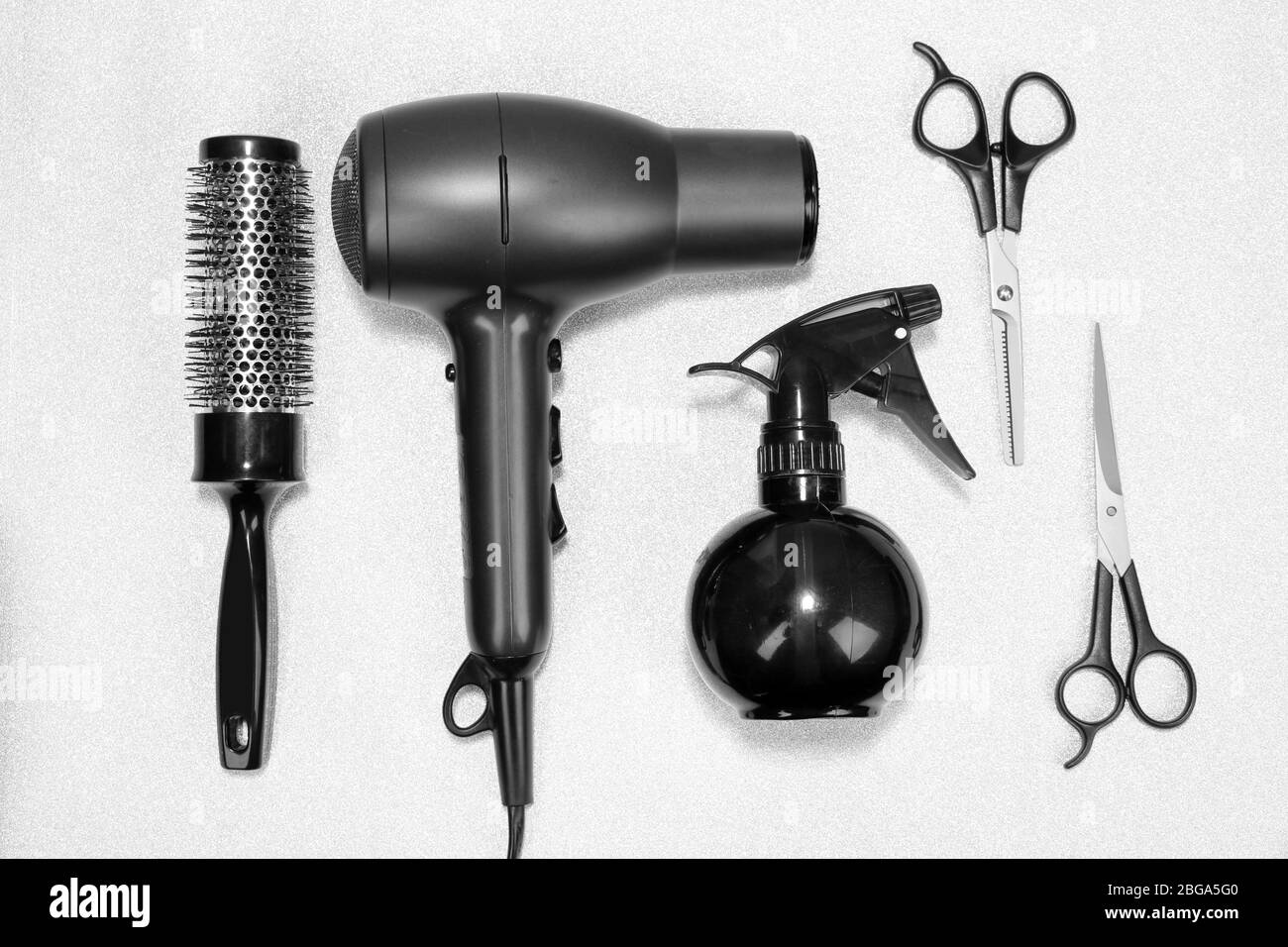 Hairdressing tools on silver background Stock Photo - Alamy