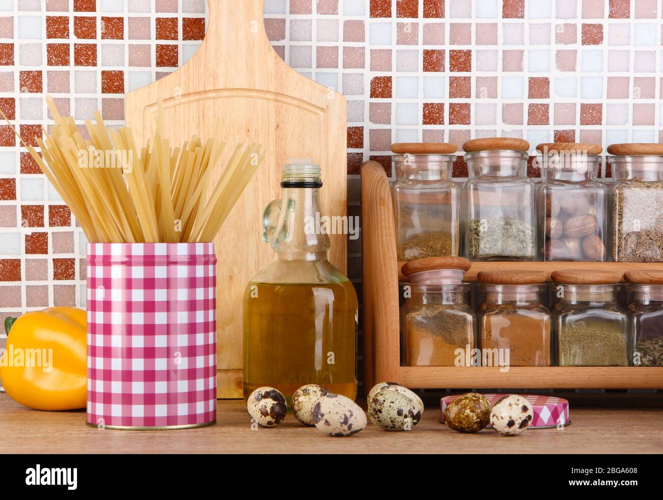 Cooking food in kitchen on table on mosaic tiles background Stock Photo ...