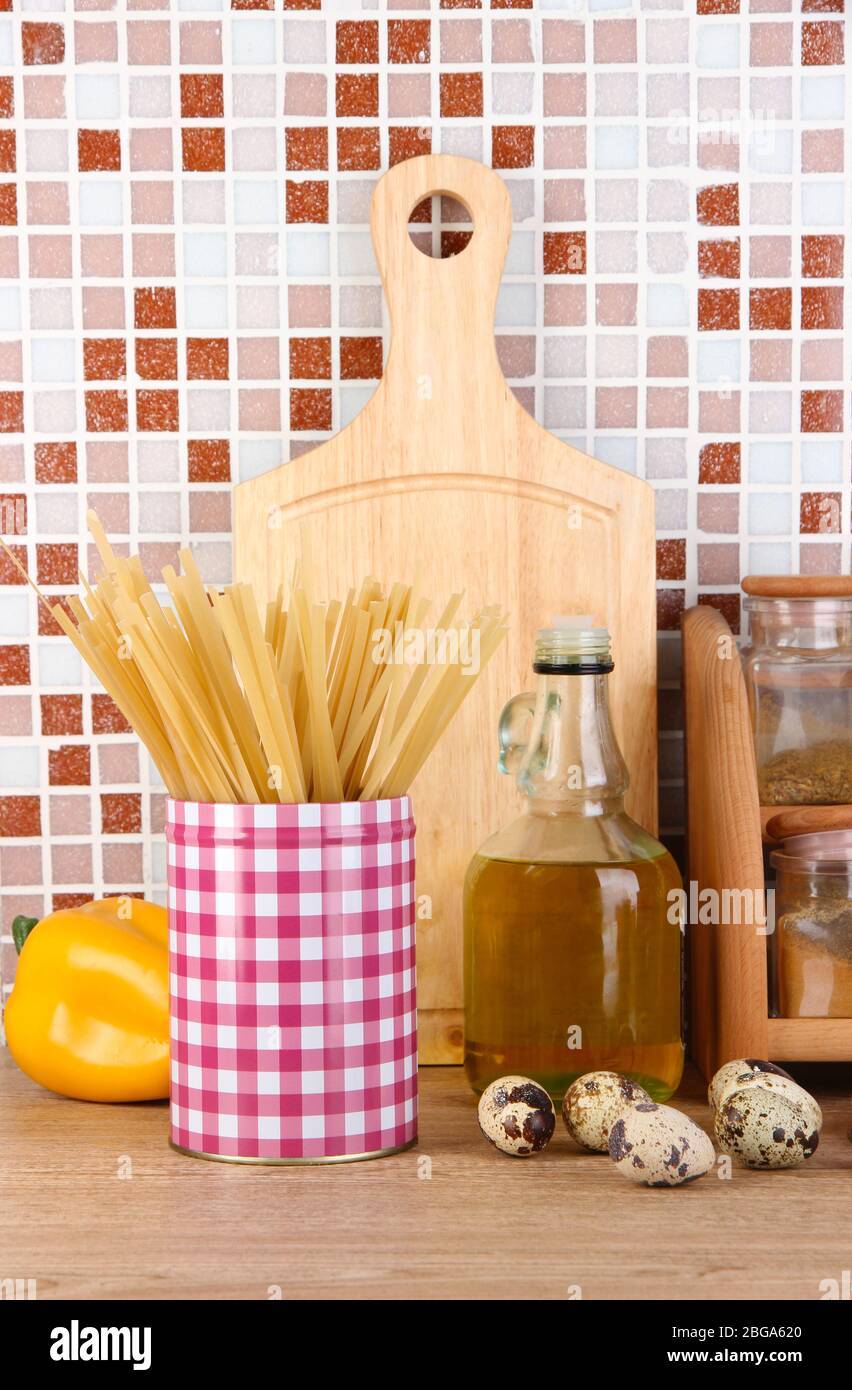 Cooking food in kitchen on table on mosaic tiles background Stock Photo ...