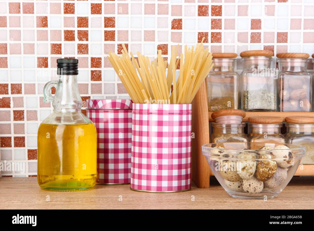 Cooking food in kitchen on table on mosaic tiles background Stock Photo ...