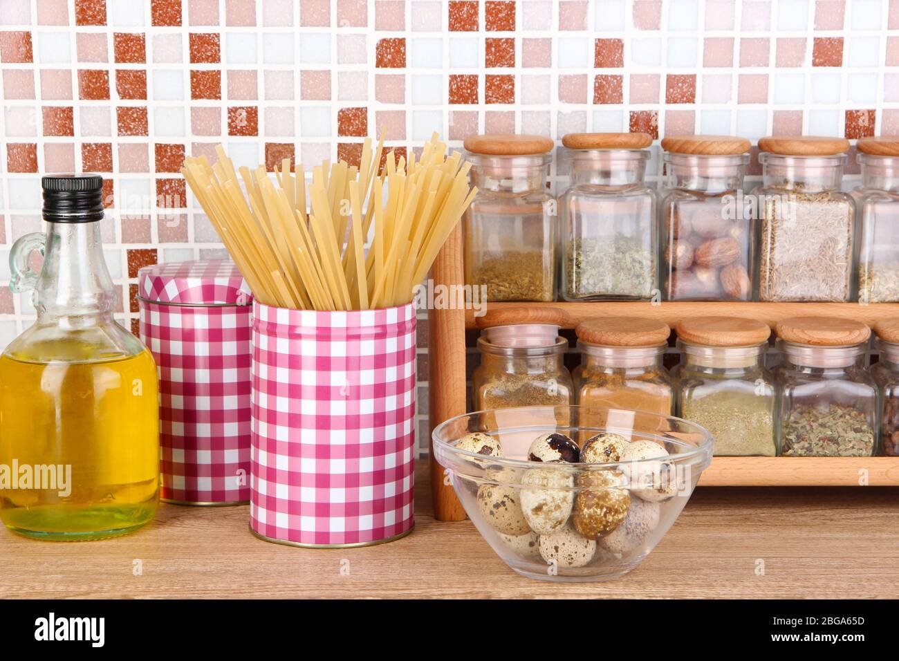 Cooking food in kitchen on table on mosaic tiles background Stock Photo ...
