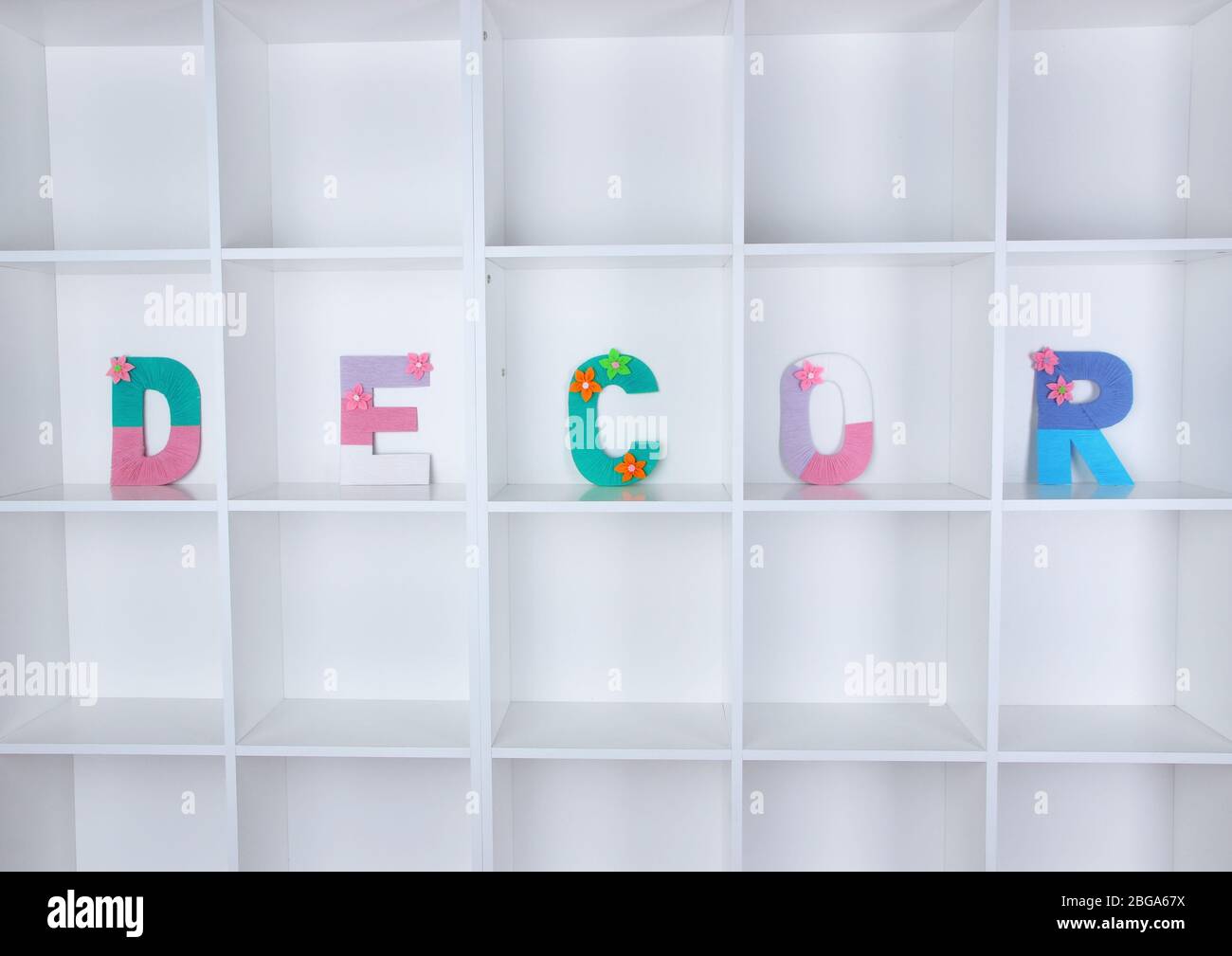 White shelves decorated with handmade knit word Stock Photo - Alamy