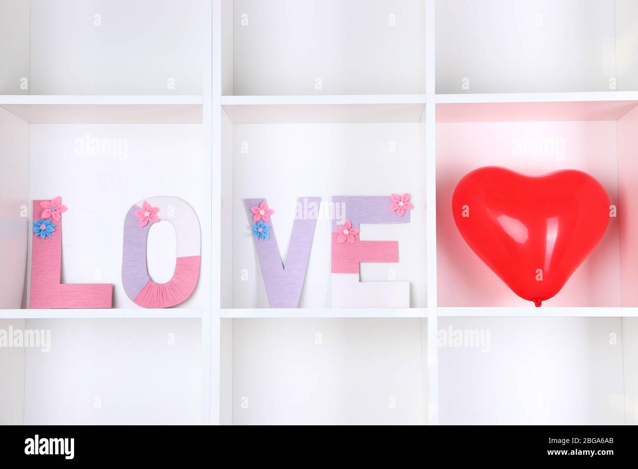 White shelves decorated with handmade knit word Stock Photo - Alamy