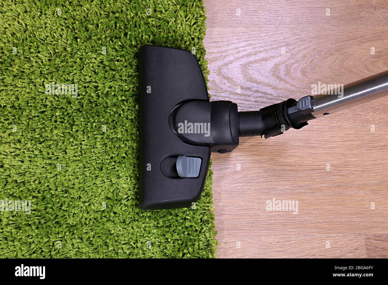 Vacuuming carpet in house Stock Photo - Alamy