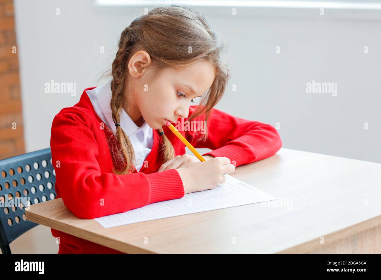 Pupil passing exam at school Stock Photo - Alamy
