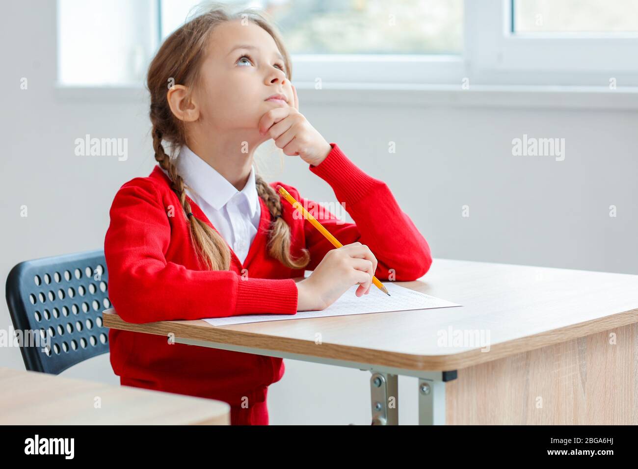 Pupil passing exam at school Stock Photo - Alamy